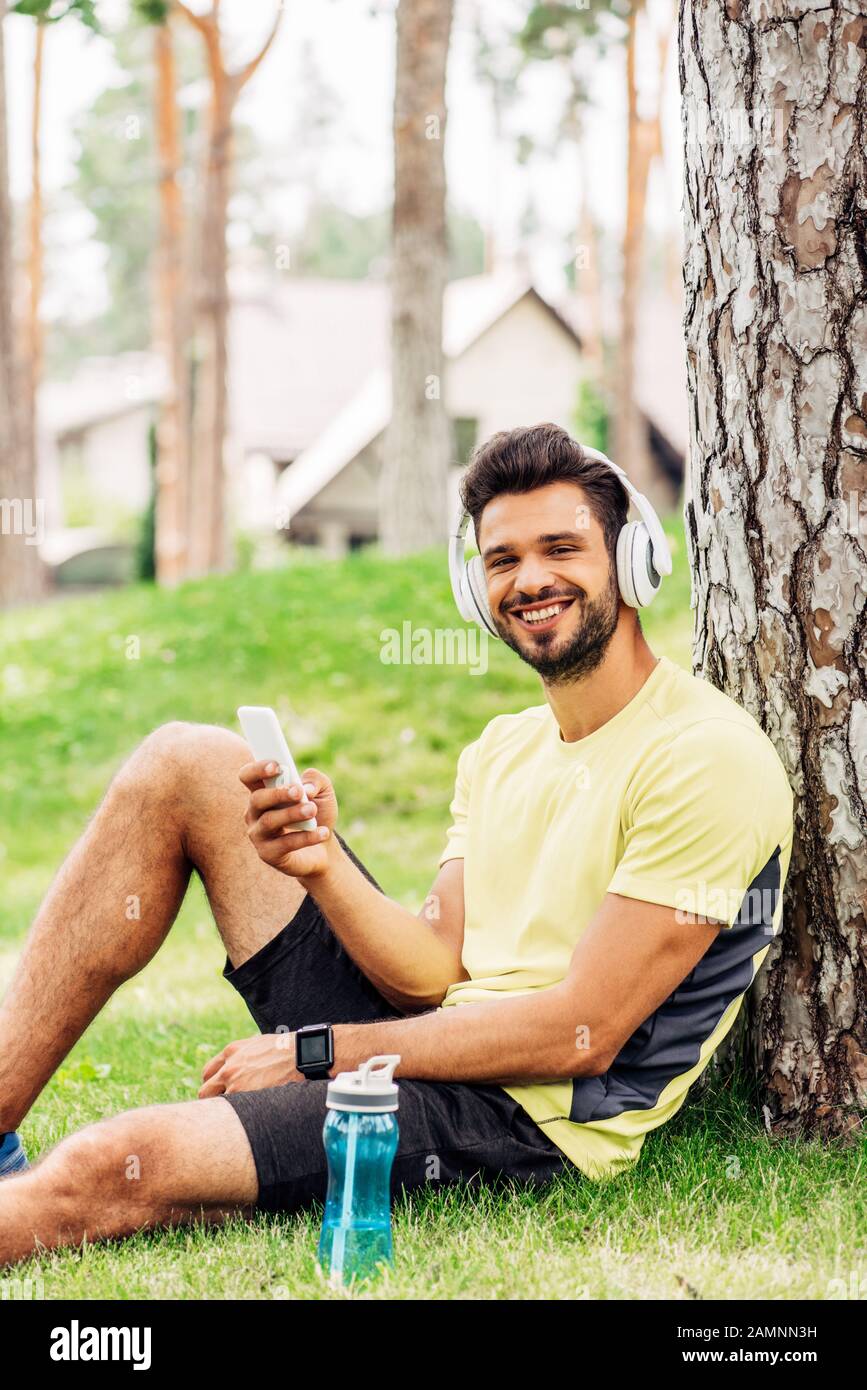 Sitting near tree hi-res stock photography and images - Alamy