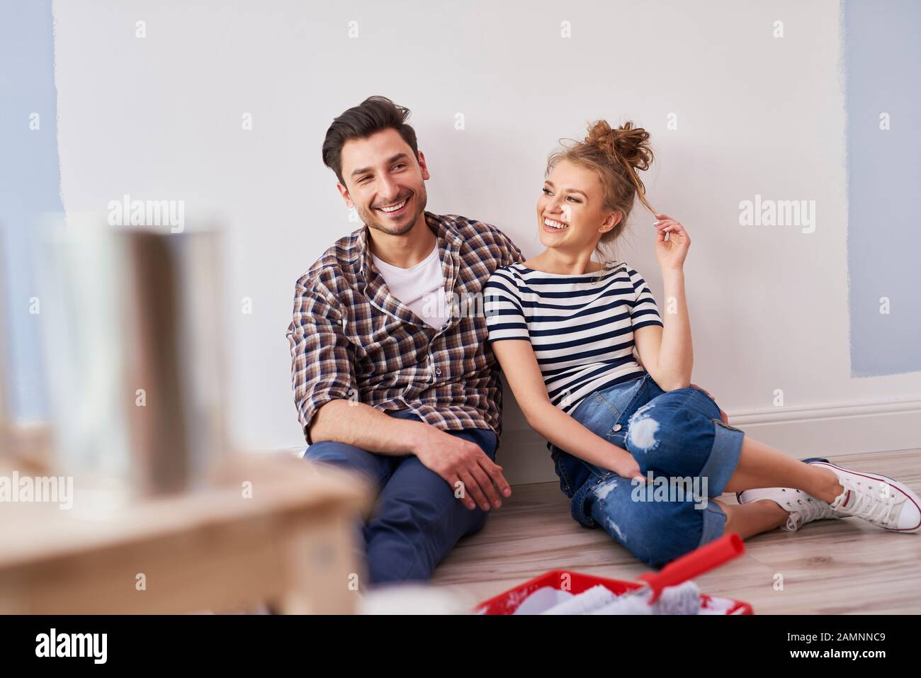 Young couple admiring home interior Stock Photo - Alamy
