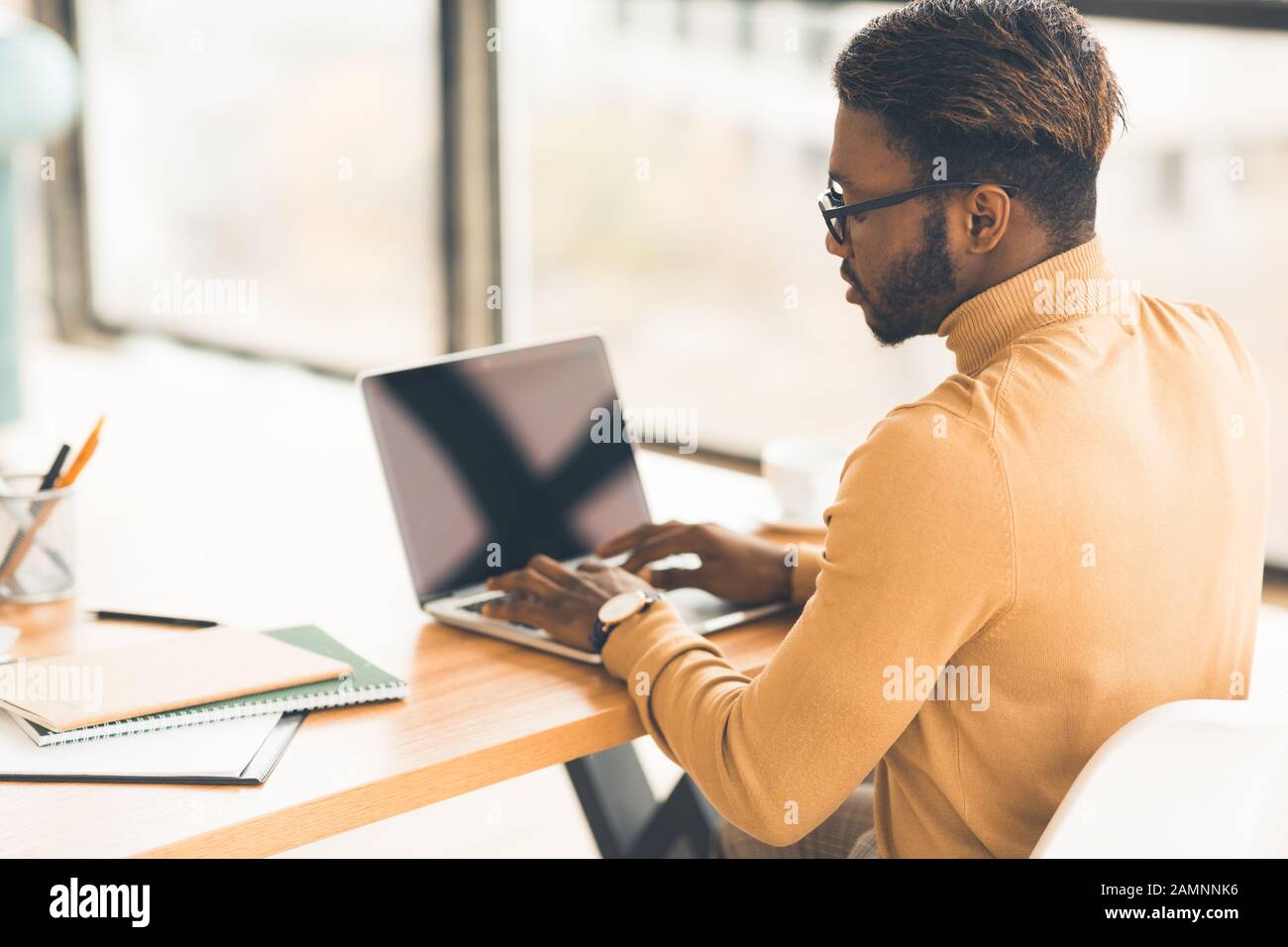 Focused black guy checking email on computer Stock Photo - Alamy