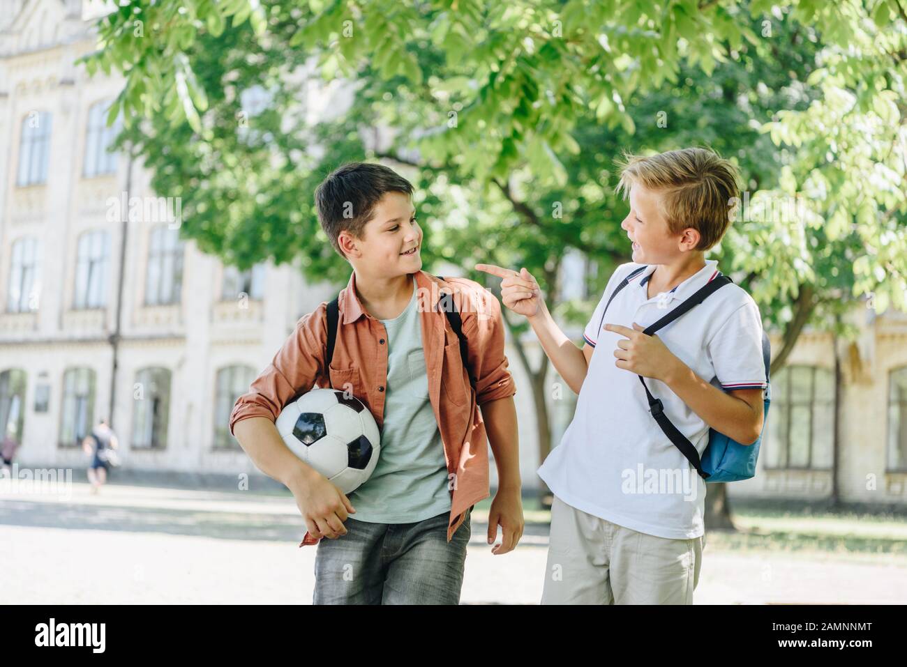 Two boys talking outside hi-res stock photography and images - Alamy