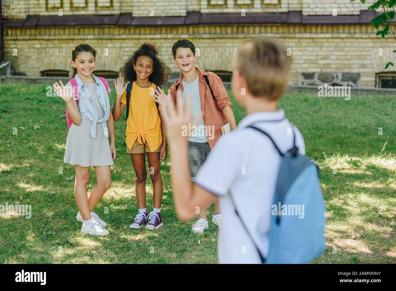Children Waving Goodbye At School