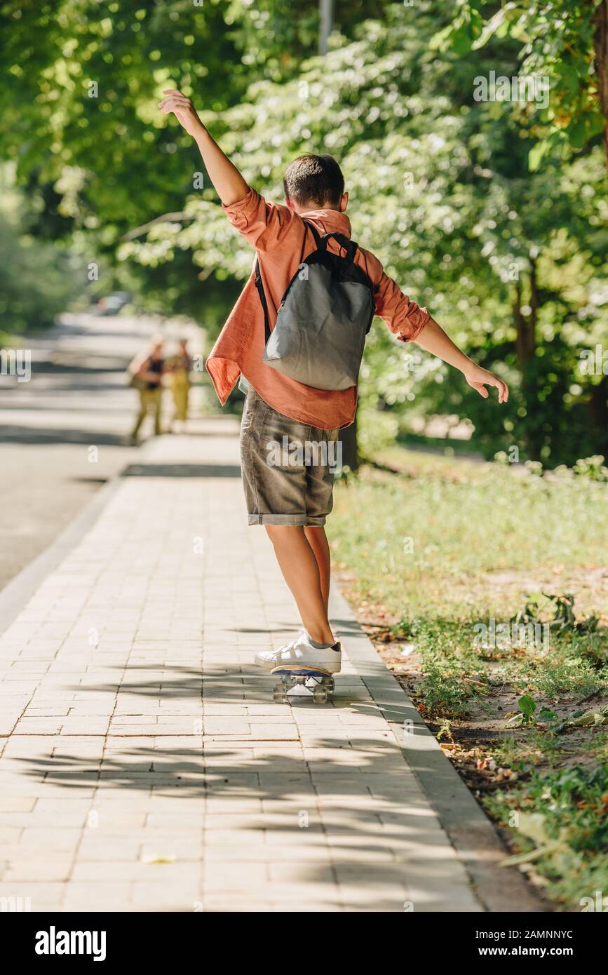 Back view of boy skateboarding on hi-res stock photography and images ...