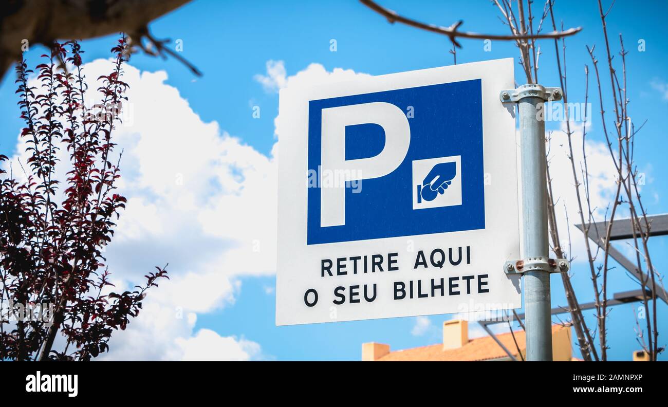 road sign indicating an automatic parking payment machine where it is ...