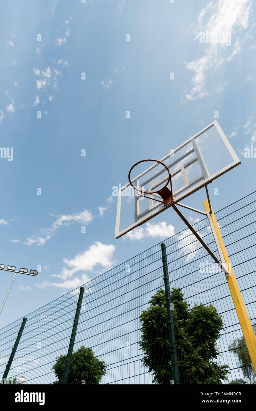 bottom view of basketball backboard under blue sky with clouds Stock ...
