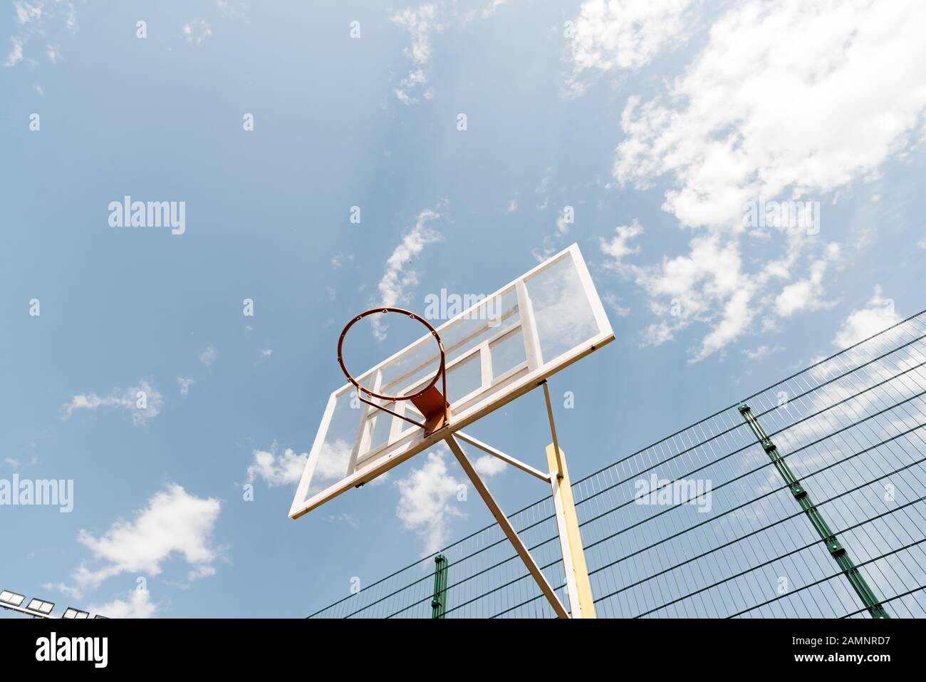bottom view of basketball backboard under blue sky with clouds Stock ...