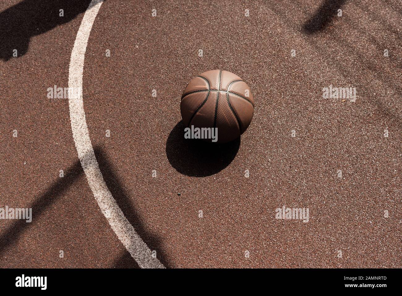 ball on brown playing surface at basketball court Stock Photo - Alamy