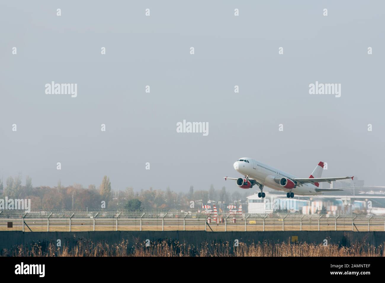Flight departure of airplane on airport runway Stock Photo - Alamy