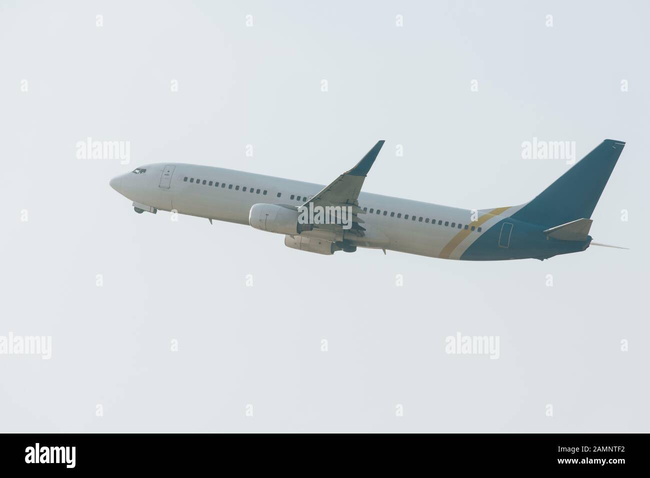 Low angle view of flight departure of jet plane in cloudy sky Stock ...