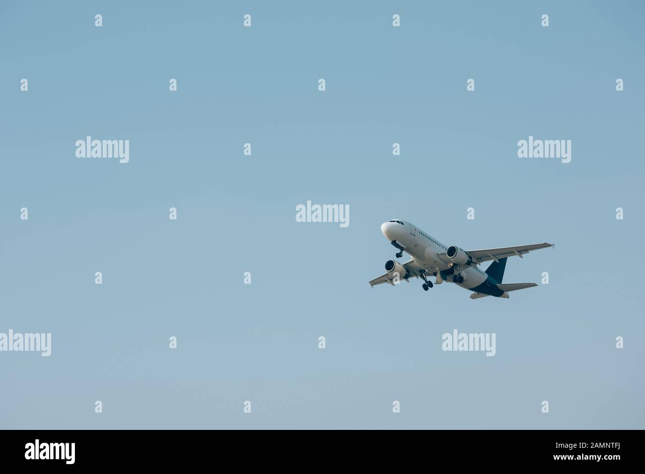 Flight departure of jet plane in clear sky Stock Photo - Alamy