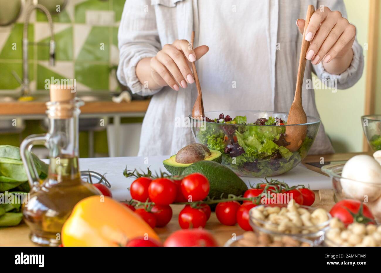 Woman mixing salad hi-res stock photography and images - Alamy