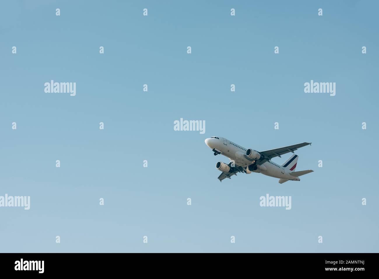 Low angle view of commercial jet plane in clear sky Stock Photo - Alamy