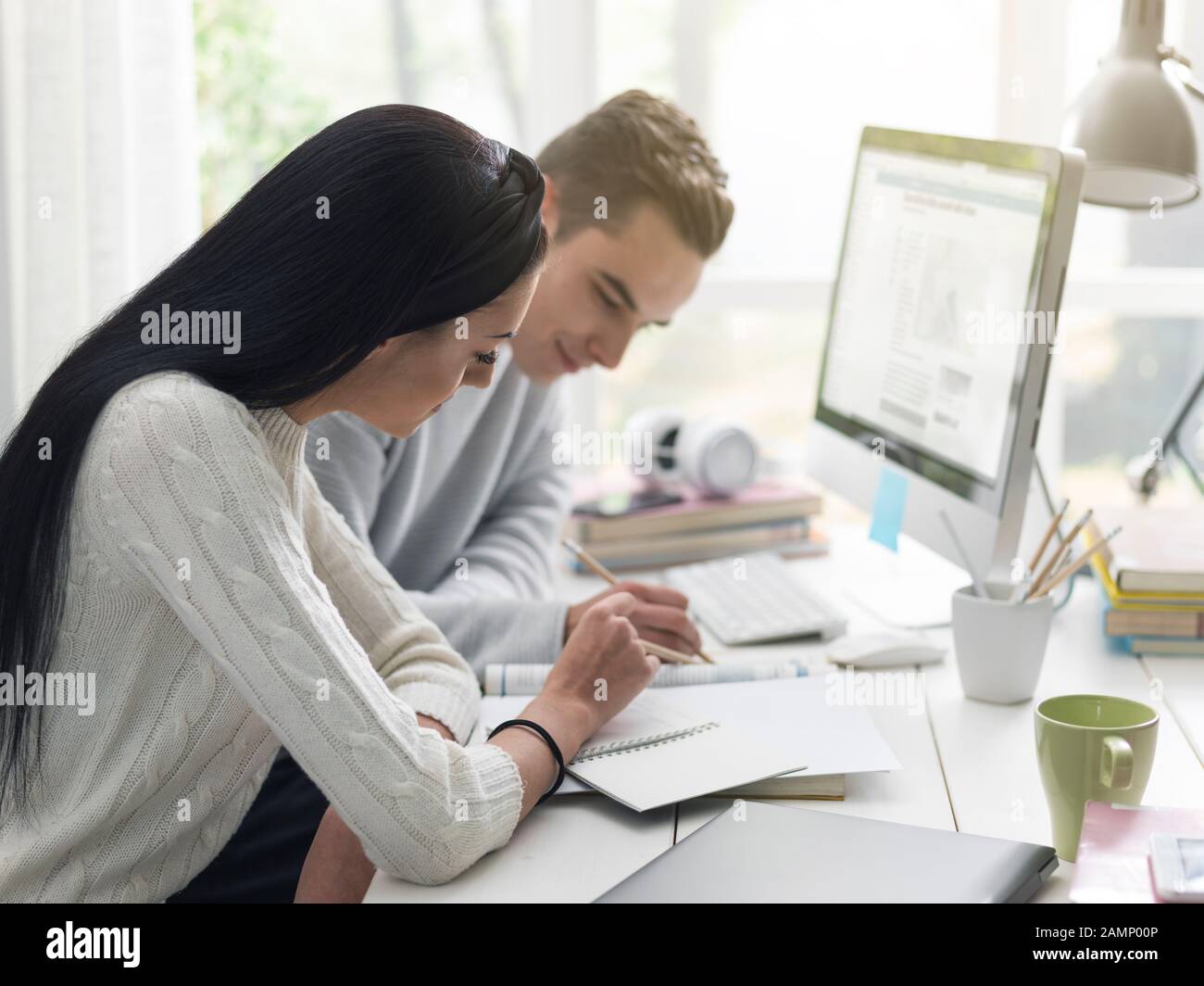 Young academic students at the library, they are studying together and ...
