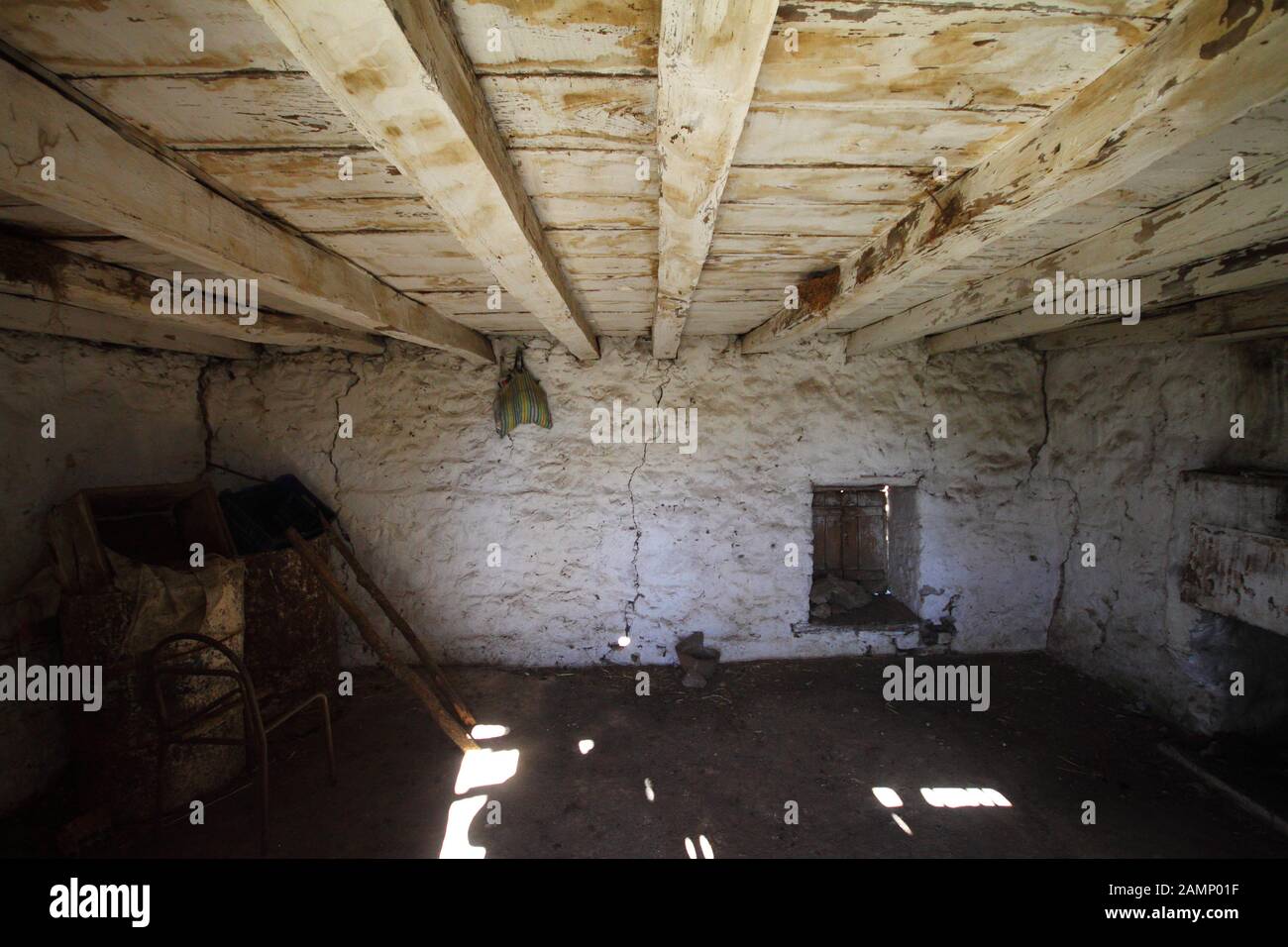 An old house built with bricks and stone A simple village architecture ...