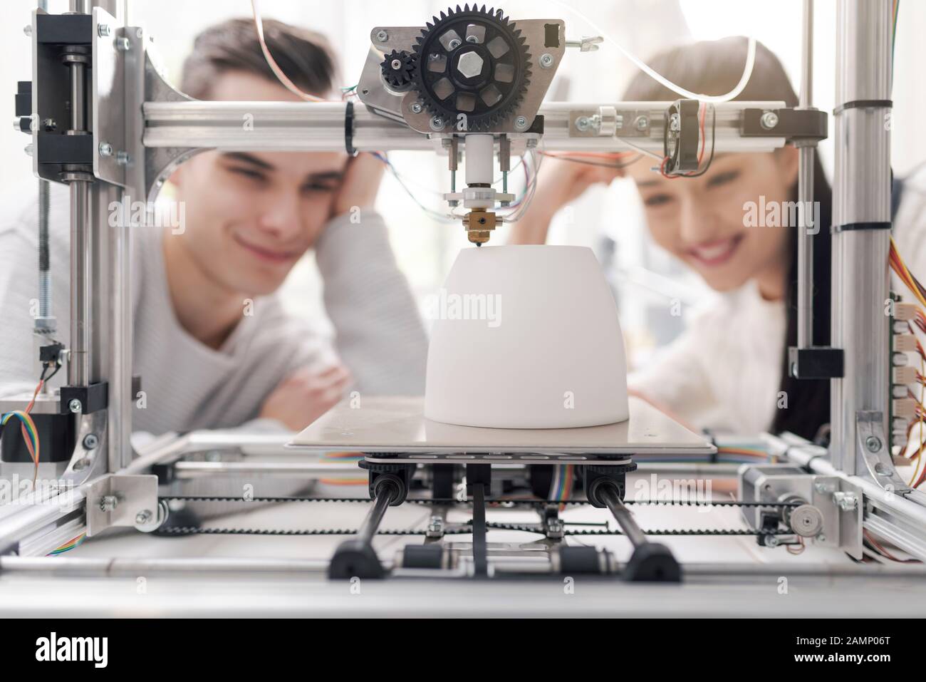 Engineering students using an innovative 3D printer in the university ...