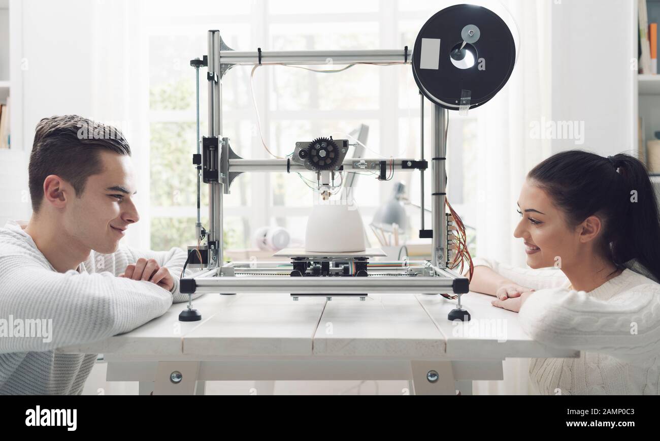 Engineering students using an innovative 3D printer in the university ...