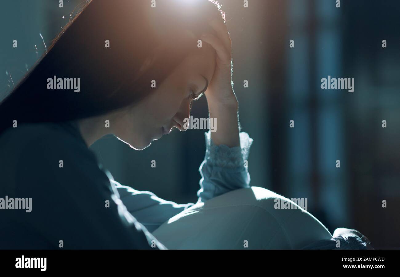 Sad depressed woman lying in bed late at night, she is suffering from ...