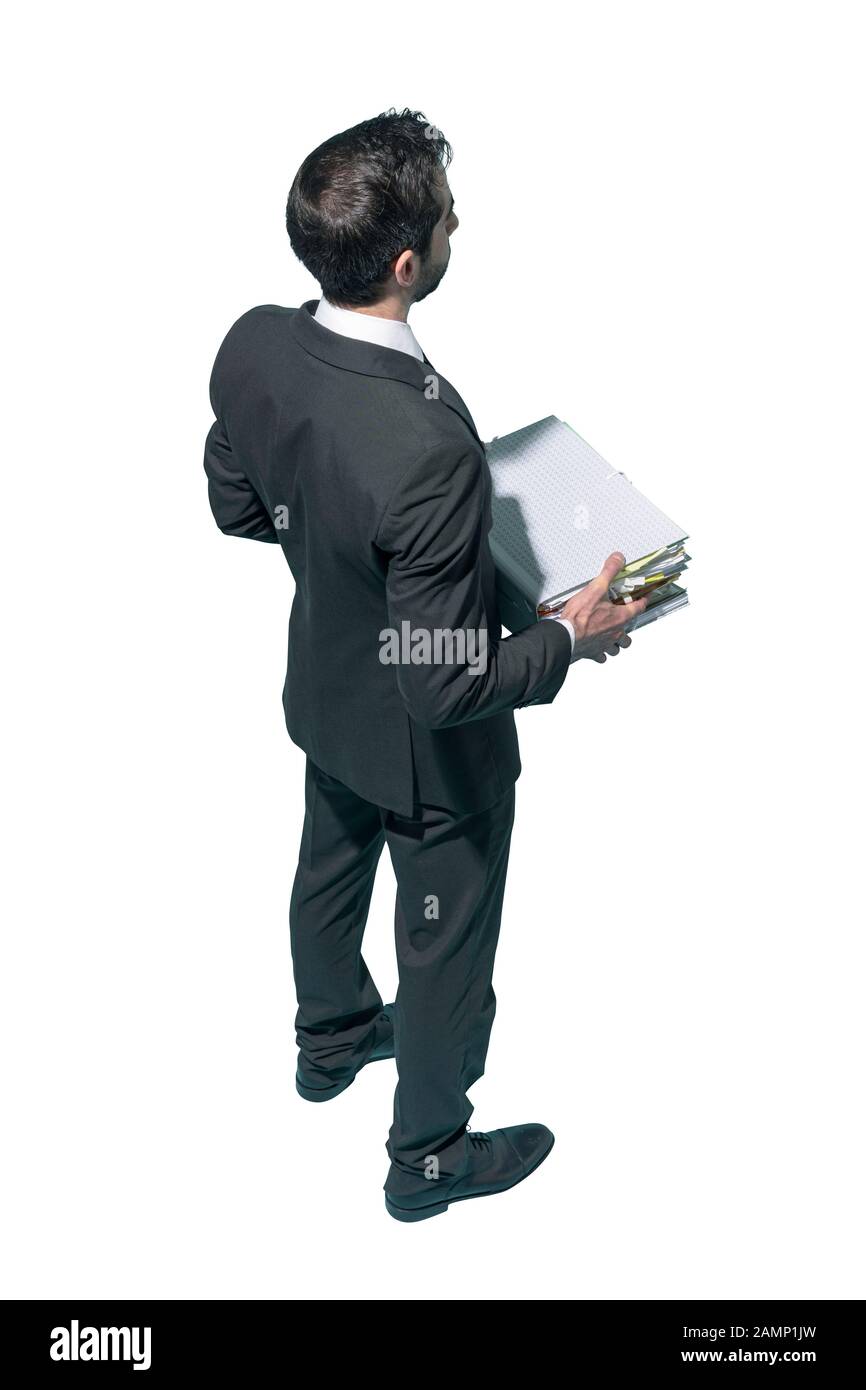 Corporate businessman standing and holding a pile of paperwork on white ...