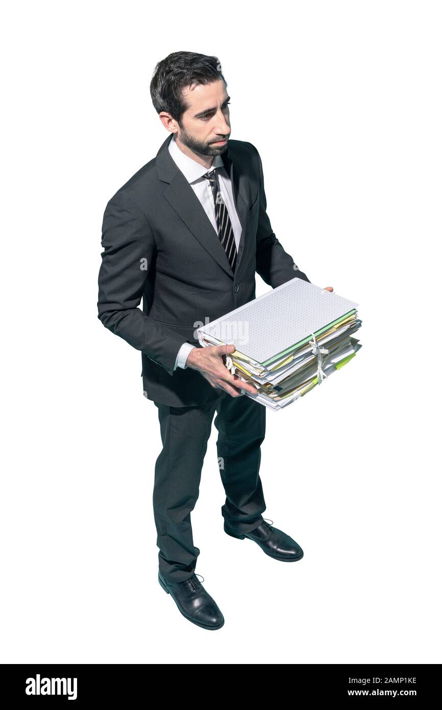 Corporate businessman standing and holding a pile of paperwork on white ...