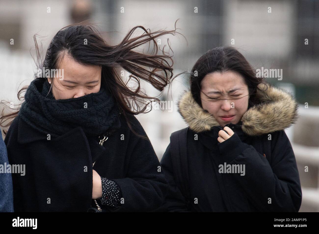 People experience strong winds as they cross waterloo bridge hi-res ...
