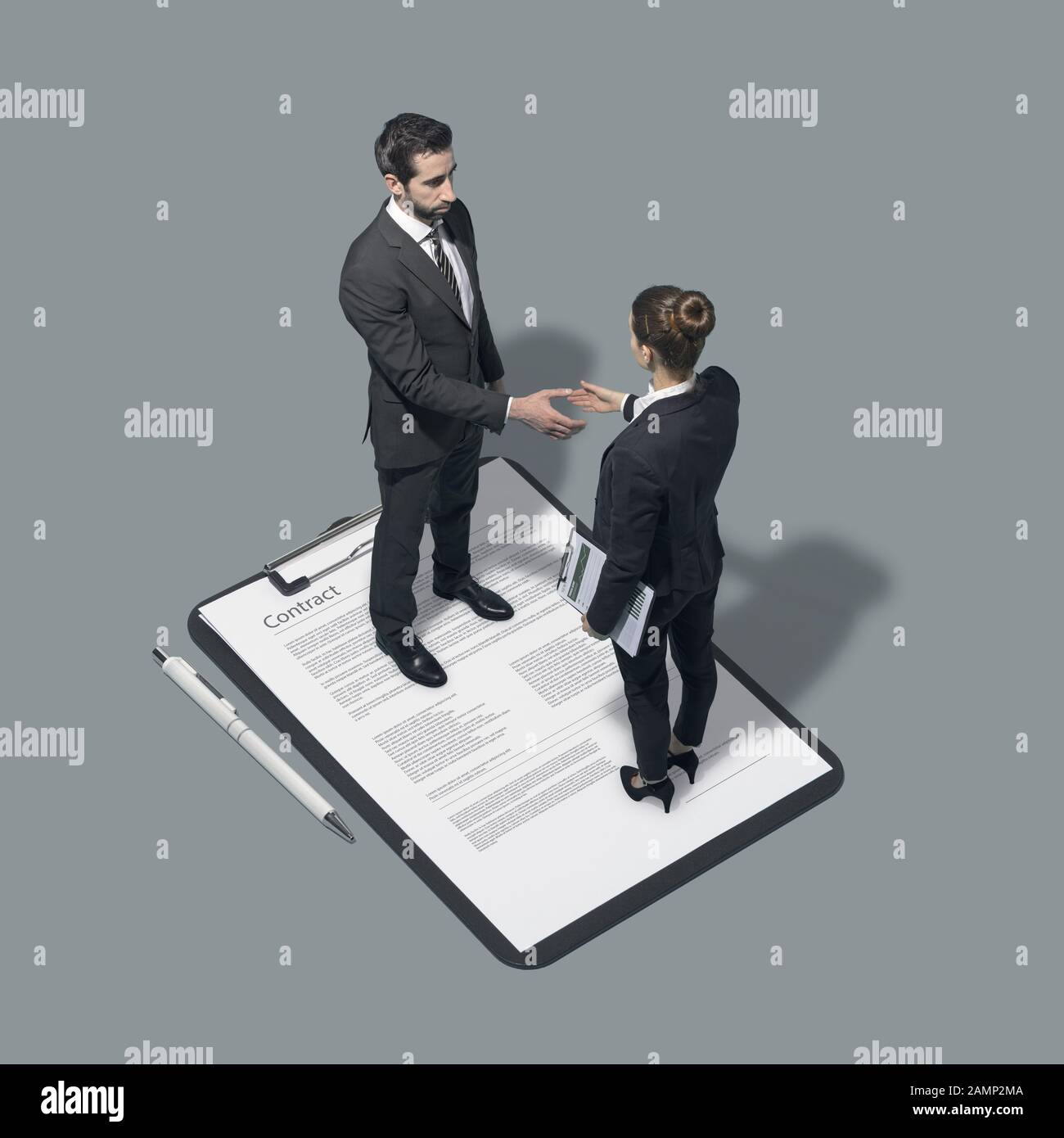 Business people signing a contract and shaking hands, agreement and ...