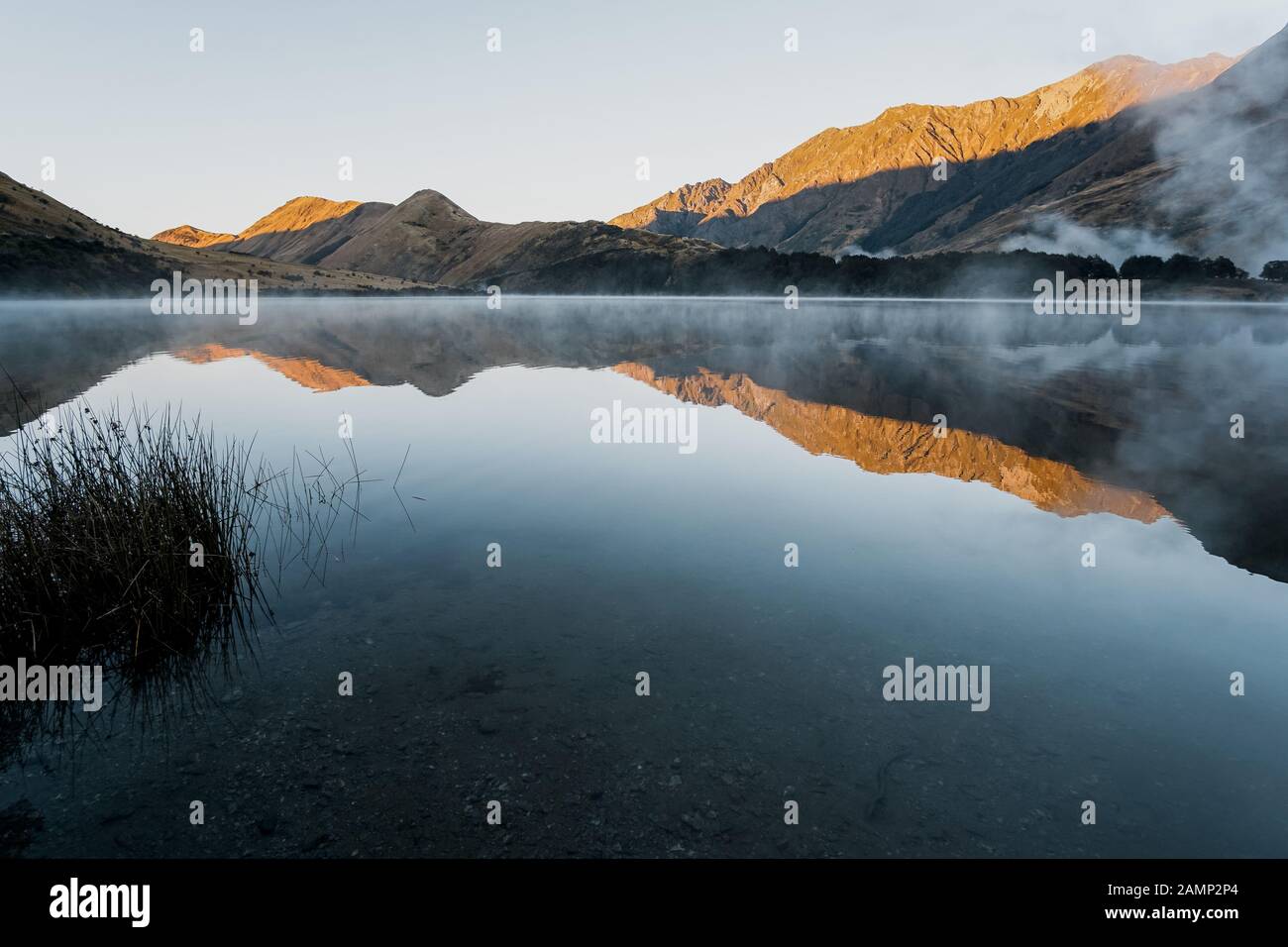 Beautiful reflections on a small lake near Queenstown Stock Photo - Alamy