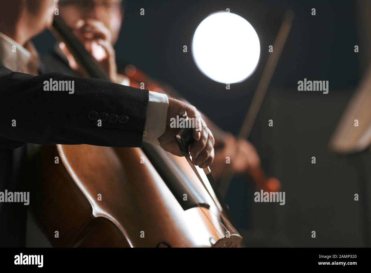 Symphonic orchestra performing on stage and playing a classical music ...