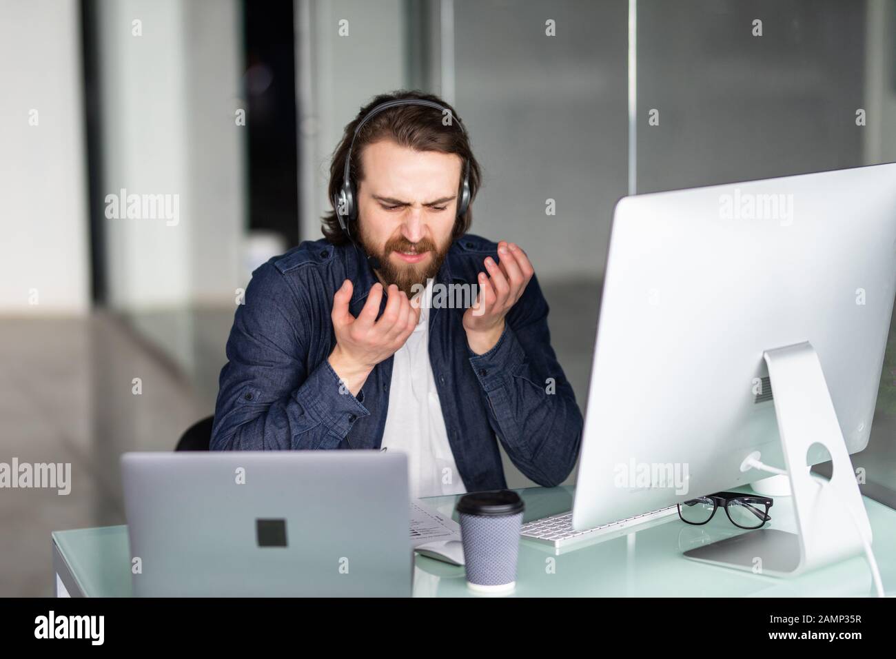 Angry man working support center hi-res stock photography and images ...