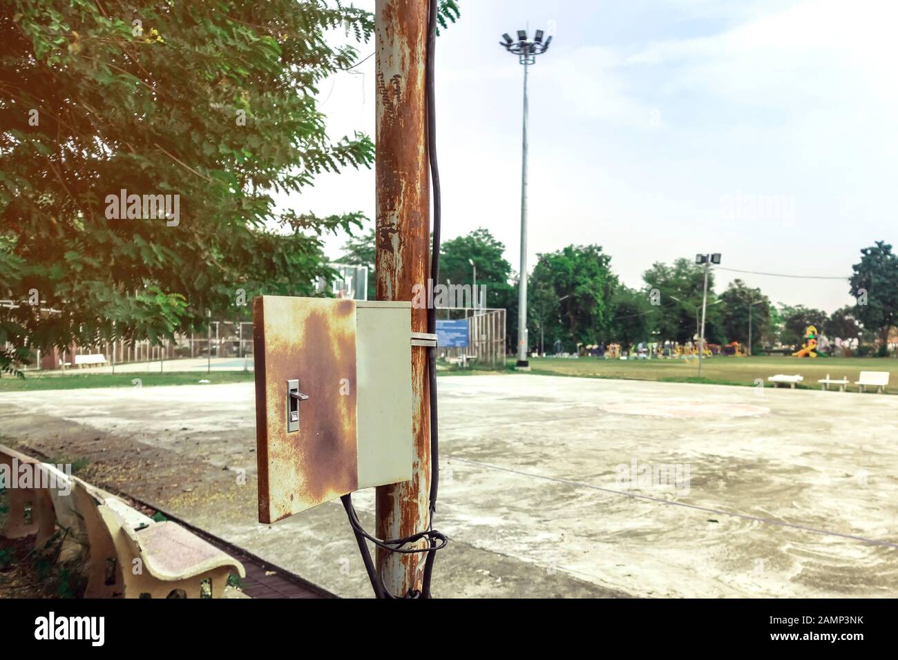 Old rusty electrical power control box on rusted electric pole in the ...
