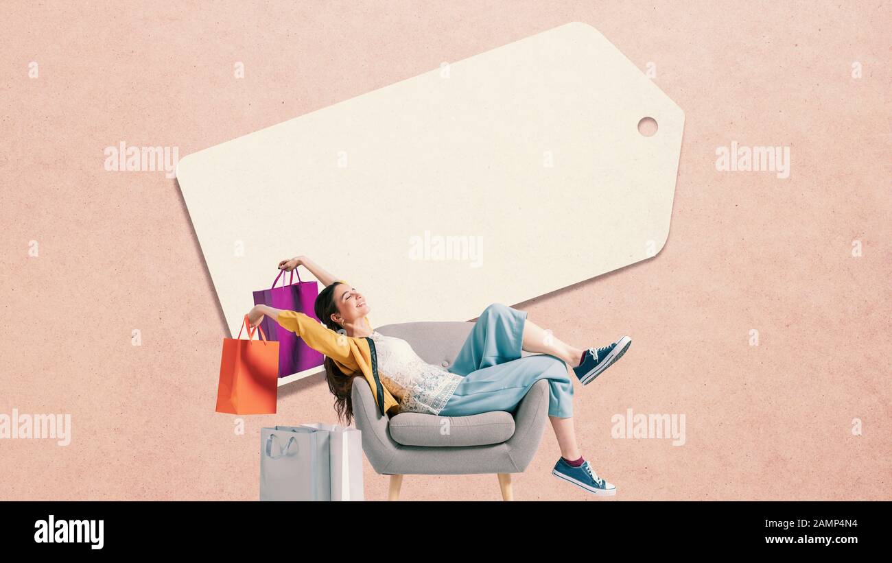 Cheerful happy shopaholic woman with lots of shopping bags and blank ...