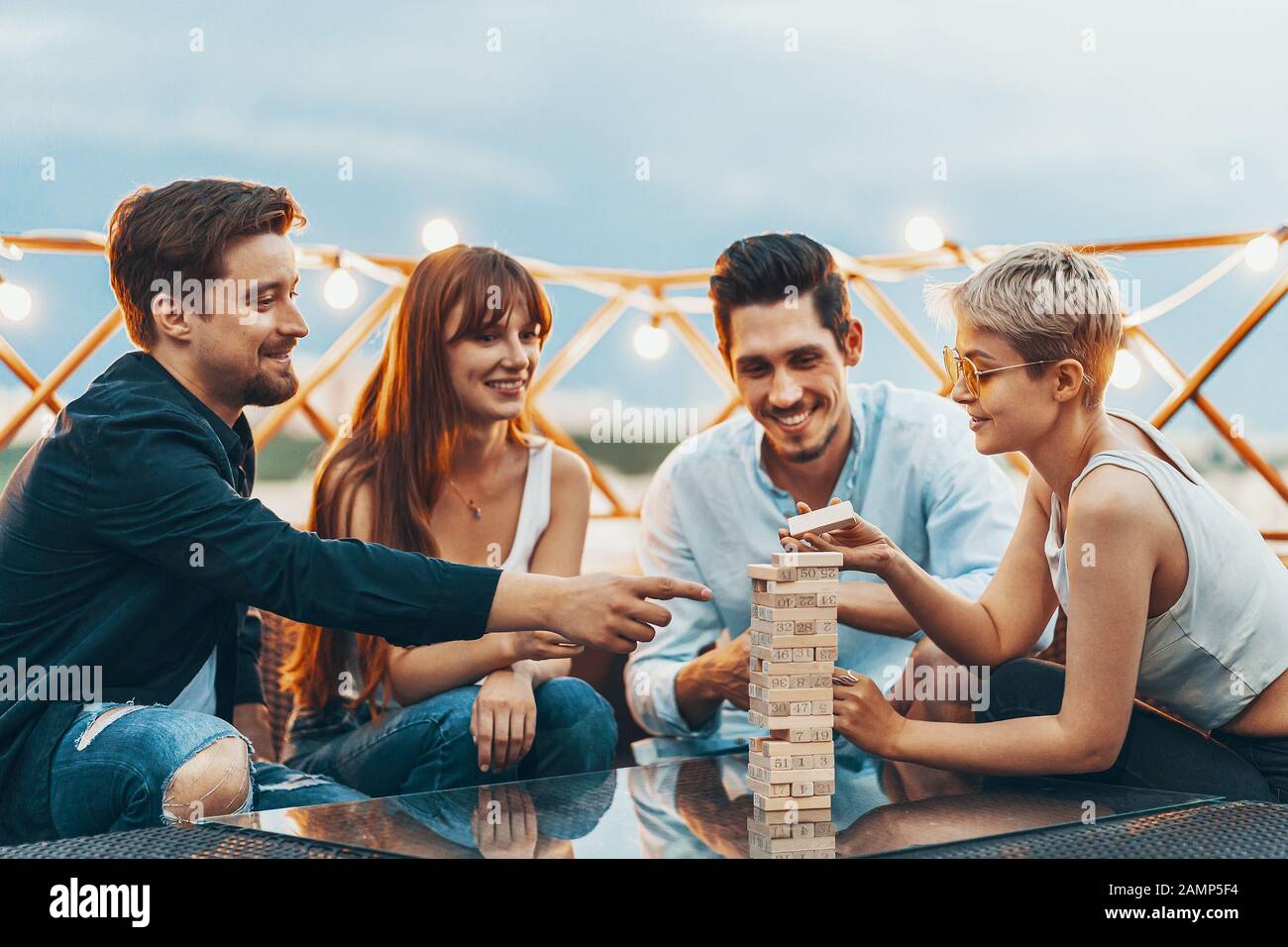 Friends playing jenga hi-res stock photography and images - Alamy