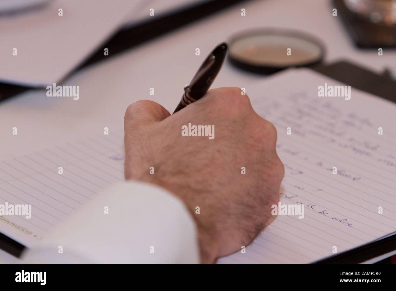 Person taking notes with people hi-res stock photography and images - Alamy