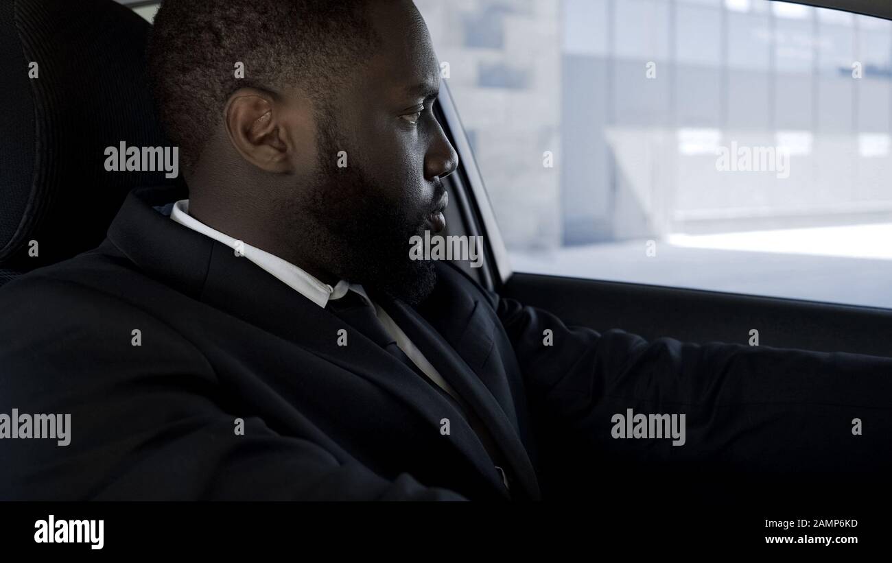 Frustrated and disappointed with problems man sitting in car confused ...