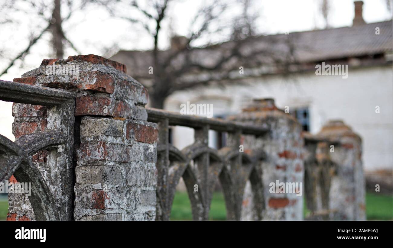 Old stone fence, in the background of an abandoned house Stock Photo ...