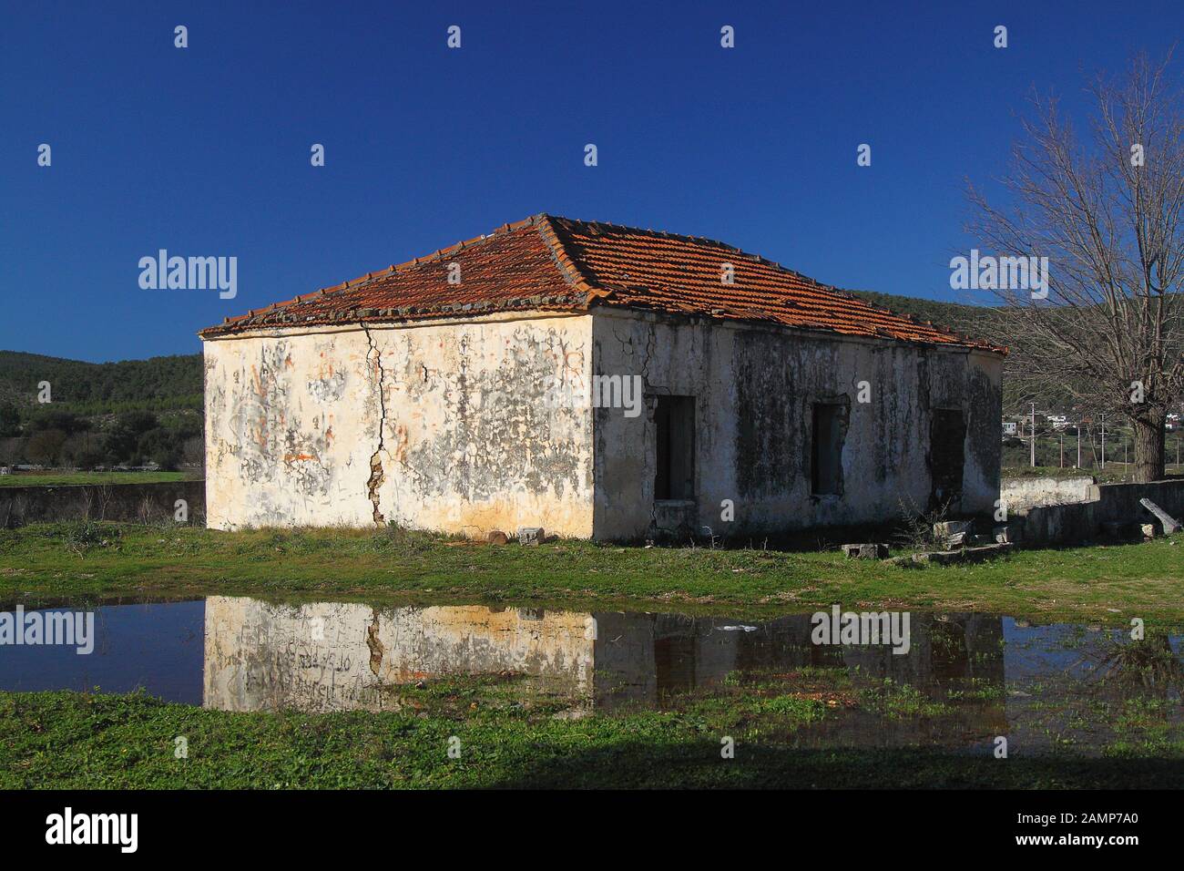 An old house built with bricks and stone A simple village architecture ...