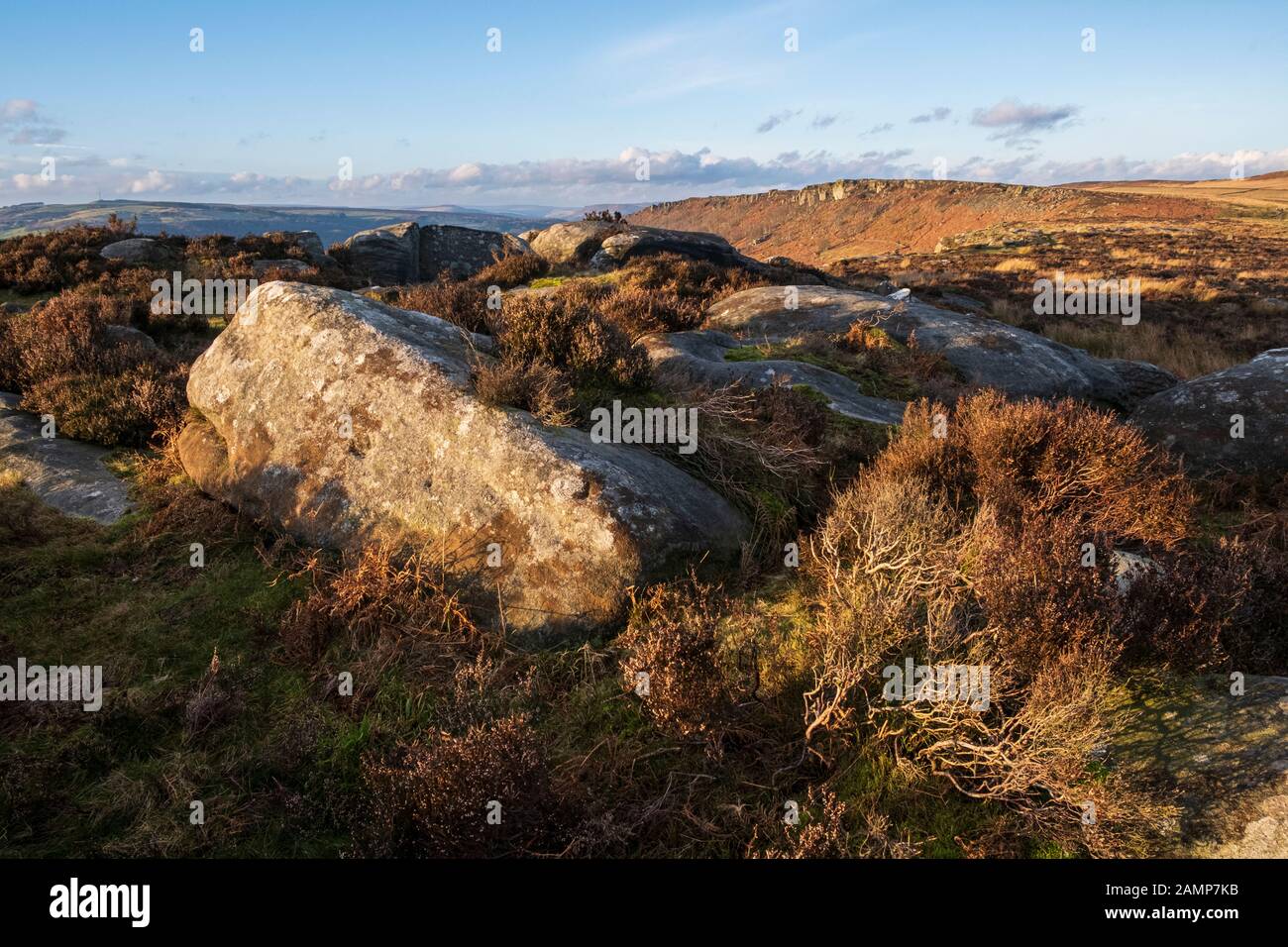 Gritstone boulders on Baslow Edge and view towards Curbar Edge, Peak ...