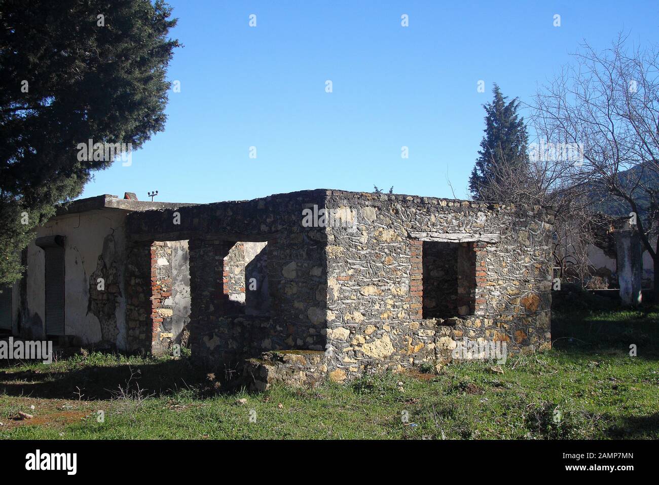 An old house built with bricks and stone A simple village architecture ...