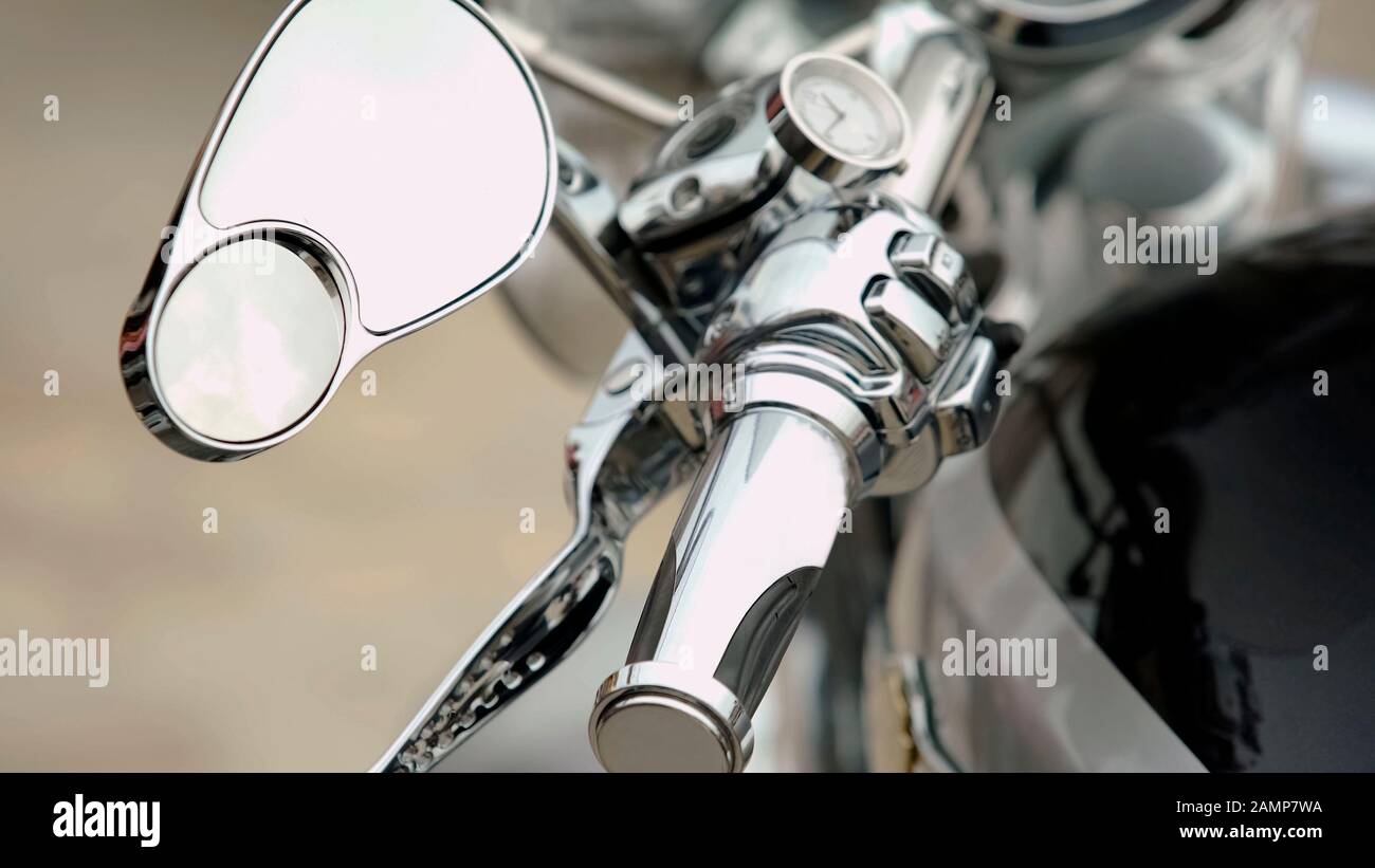 Close-up of motorcycle control panel with speedometer and handles ...