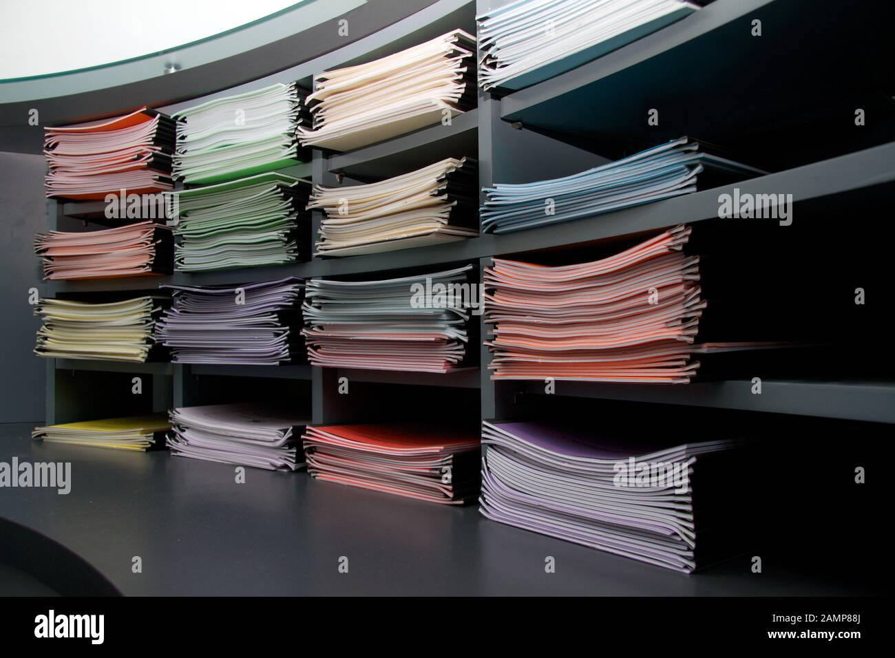 Office shelves stacked with multi-coloured folders and documents Stock ...