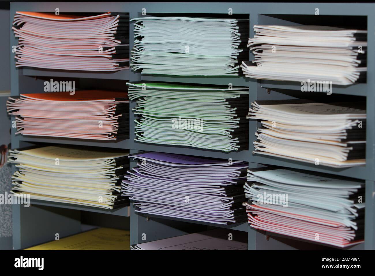 Office shelves stacked with multi-coloured folders and documents Stock ...