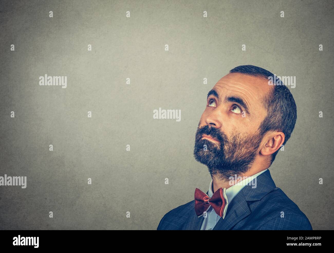 Headshot confused man thinking looking up to the side interested ...