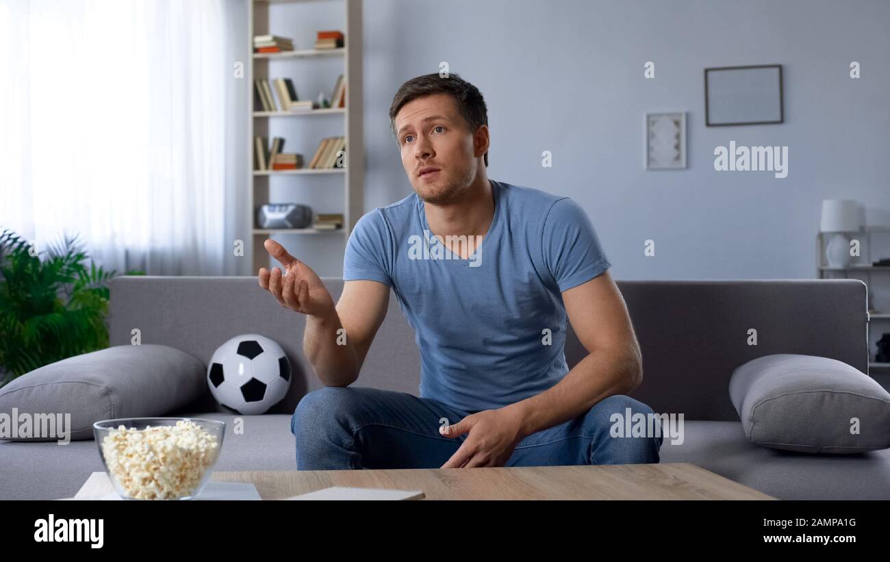 Upset man shocked by game score, defeat of football team, unhappy fan ...