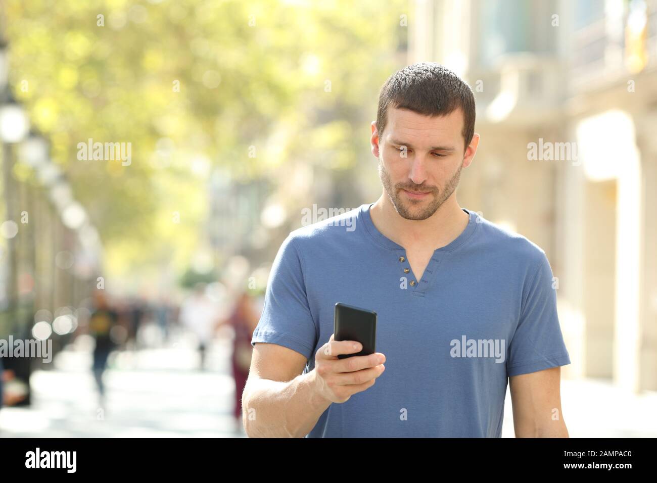 Man walking towards camera hi-res stock photography and images - Alamy