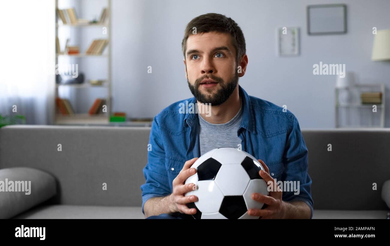 Excited man watching football hi-res stock photography and images - Alamy