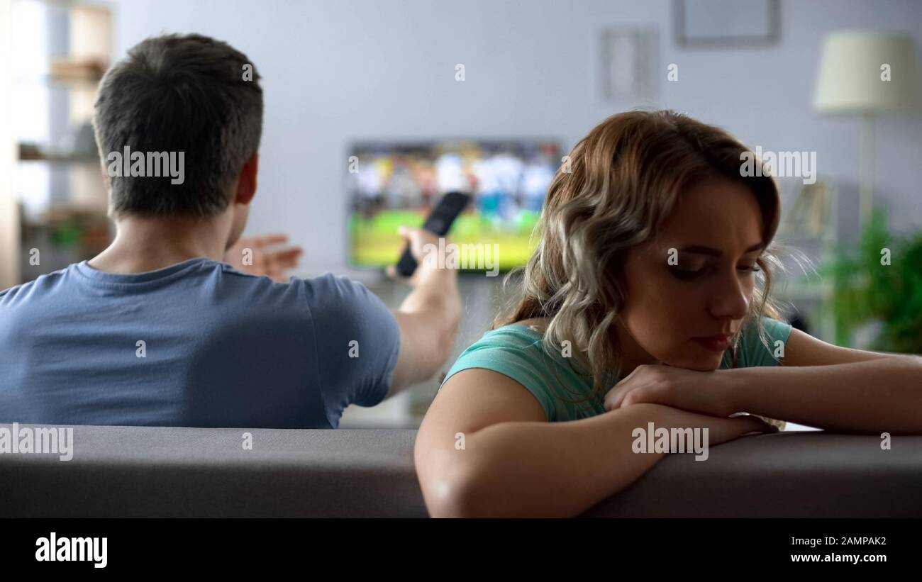 Couple arguing over watching tv, man and woman having conflict ...