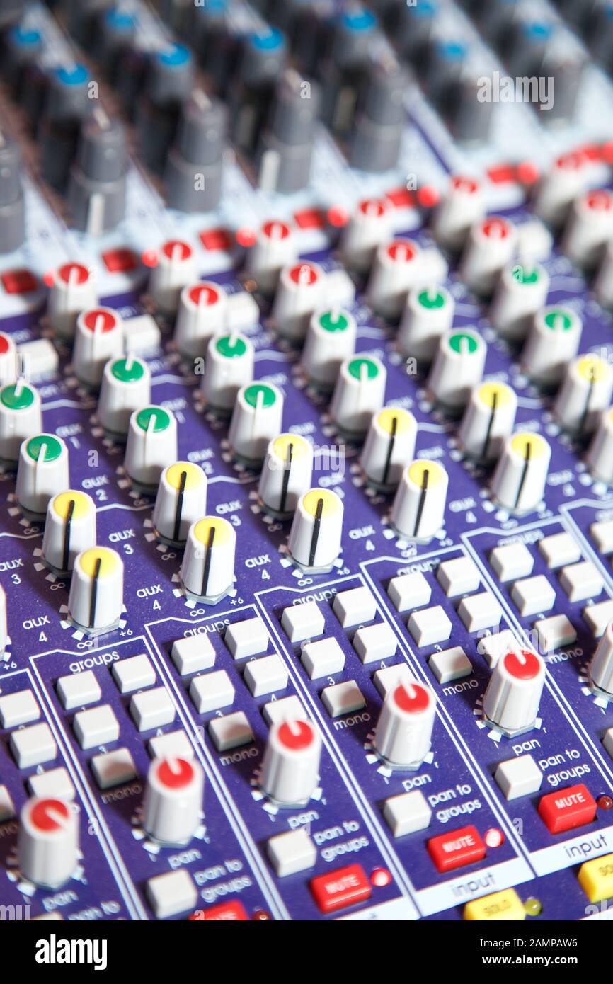 Close up of the knobs and switches on an audio mixing console Stock ...