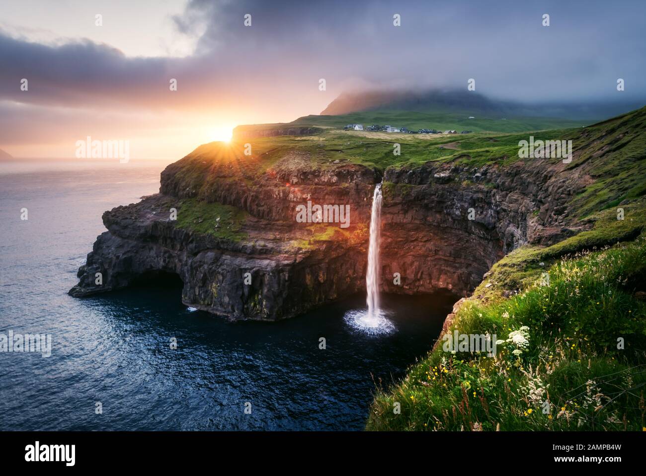 Incredible sunset view of Mulafossur waterfall in Gasadalur village ...