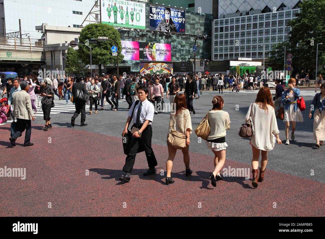 TOKYO, JAPAN - MAY 11, 2012: Pedestrians walk the Hachiko crossing in ...