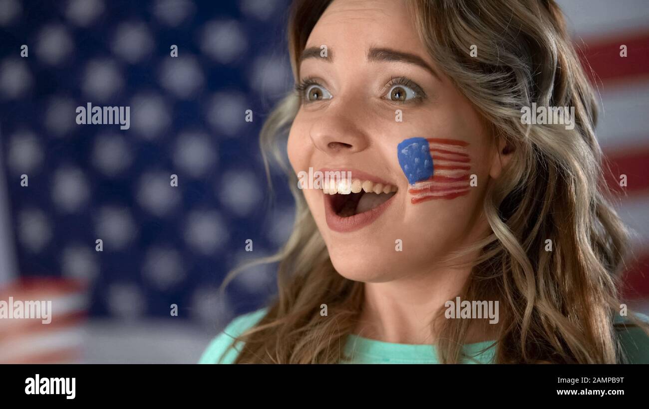 Happy American girl cheering with smile on face, supporting candidate ...