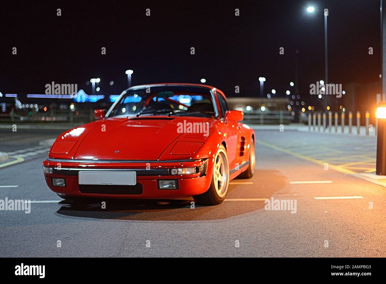Ruf flat nose Porsche 911 Turbo parked on an urban car park at night ...