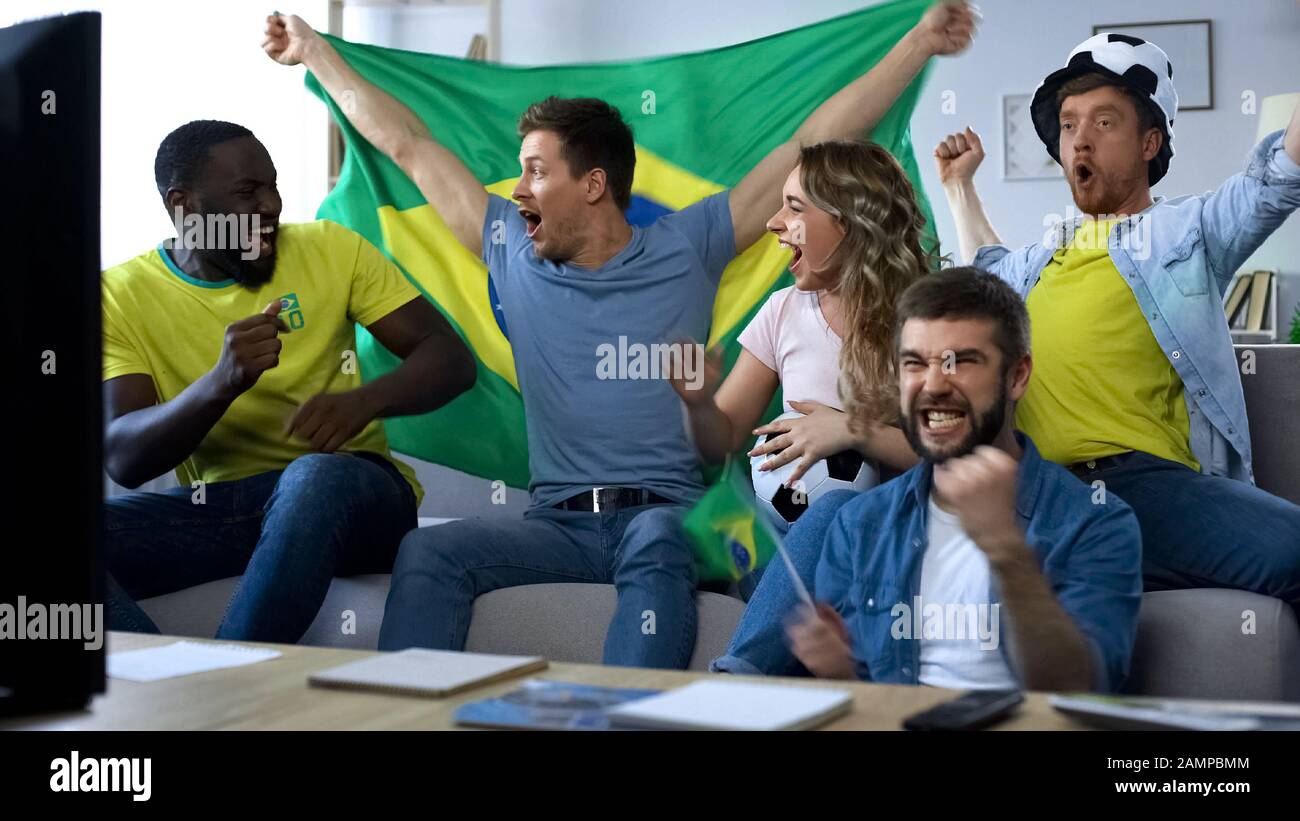 Brazilian friends celebrating brazil flag hi-res stock photography and ...
